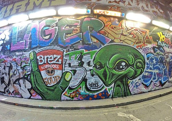 Graffiti alien holding a Campbell's soup tin - London Street Art