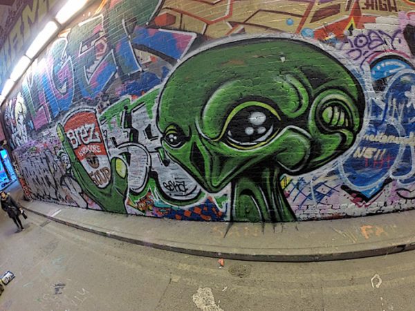 Graffiti alien holding a Campbell's soup tin - London Street Art